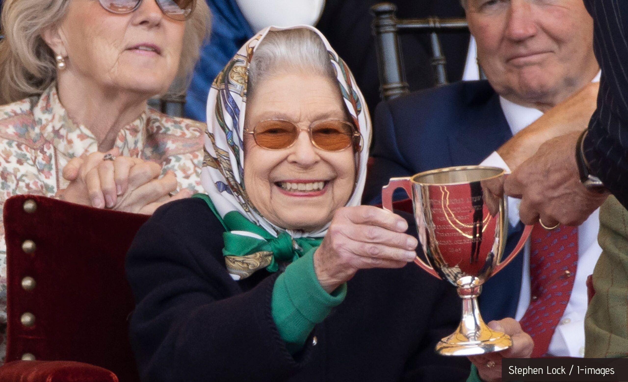 A delighted Queen receives trophy after her highland pony wins at the ...